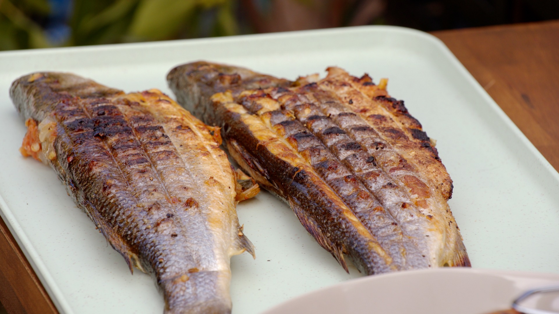 Eva’s Roasted Branzino stuffed with Tomato-Ginger Sofrito | Tastemade
