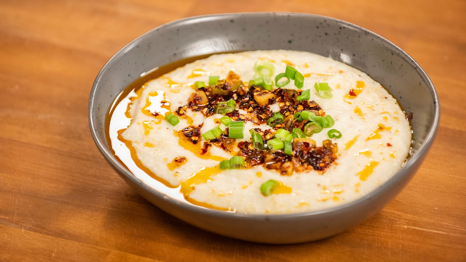 Stone Ground Grits with Scallions & Garlic Chili Oil | Tastemade